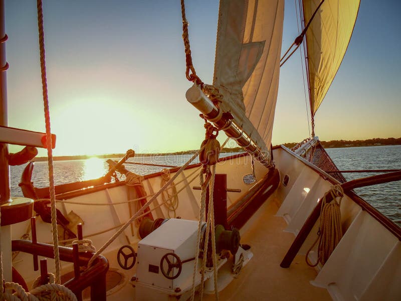 Sailing into the Sun stock image. Image of boats, sailing - 107701359