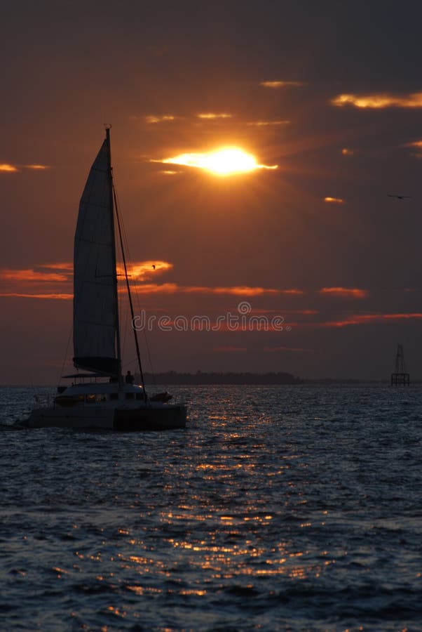 Sailing at sunset stock photo. Image of sunset, dusk, ocean - 2082602