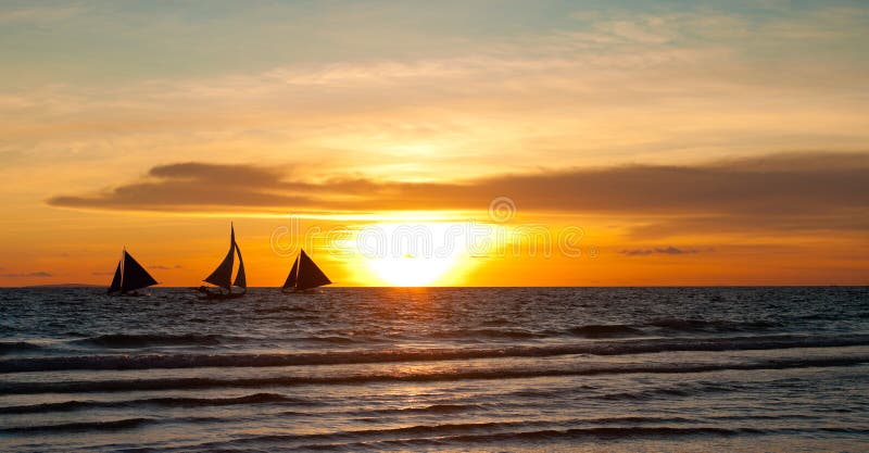 Sailing at sunset stock photo. Image of coast, orange - 23090492
