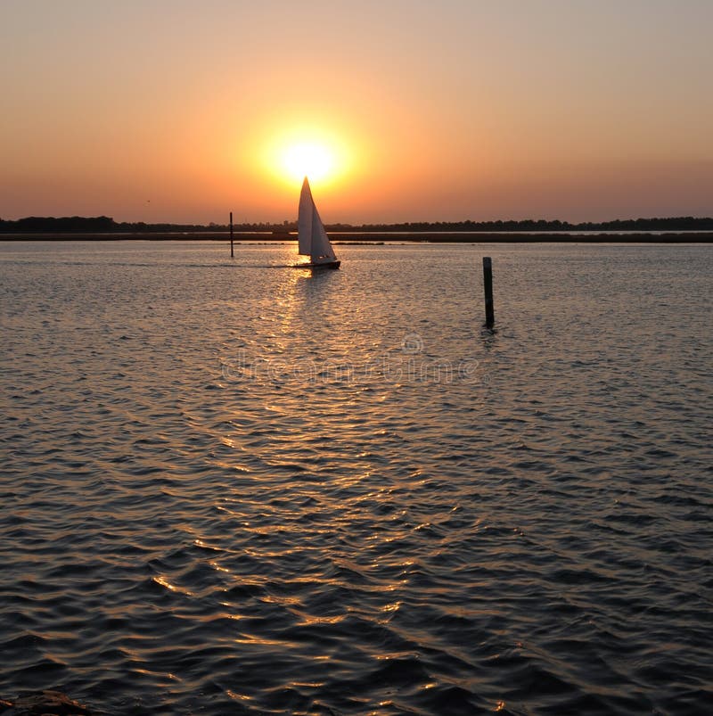 Sailing at sunset stock image. Image of orange, profile - 23334611