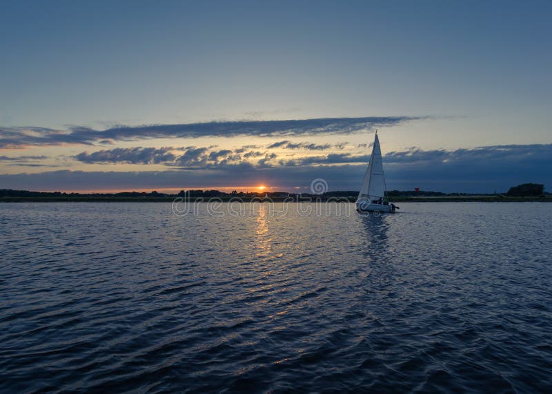 Sailing at sunset stock photo. Image of postcard, dawn - 288099106