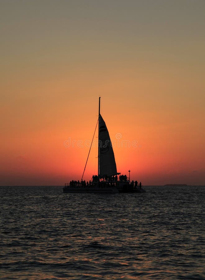 Sailing into the sunset stock photo. Image of sailboats - 47161394