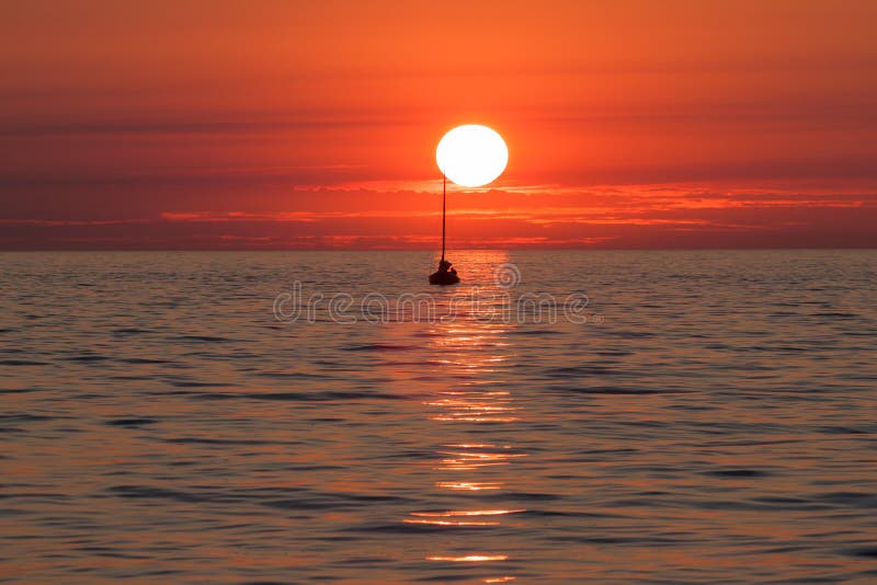 Sailing at sunset stock photo. Image of silhouette, orange - 39283142