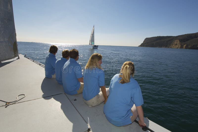 Sailing Team Sitting on Boat Stock Image - Image of people, adventure ...