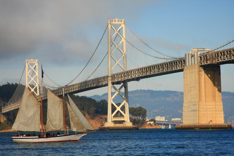 Sailing Under the Bay Bridge Stock Photo - Image of schooner, bridge ...