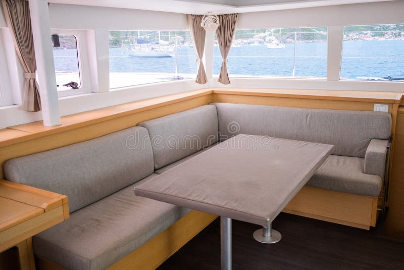 Sailing Yacht Interior with the Sea and Ships in the Background Stock ...