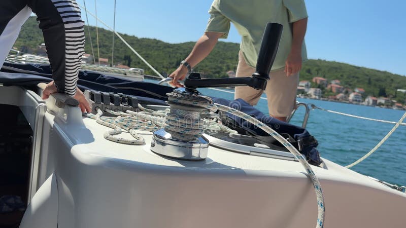 Sailing Yacht Master Opens Sail Using Winch, Yacht Goes with Right Roll ...