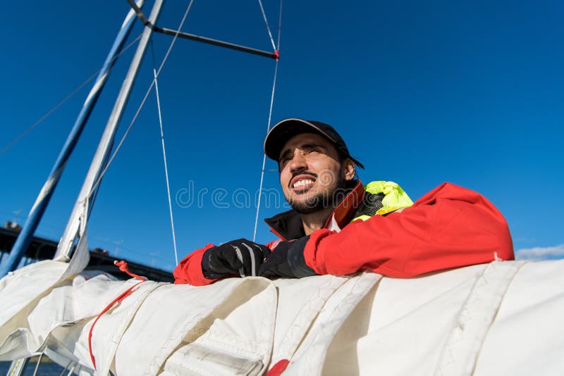Sailor Man at Boat Bow with Cap Looking Away the Sea while Sailing ...