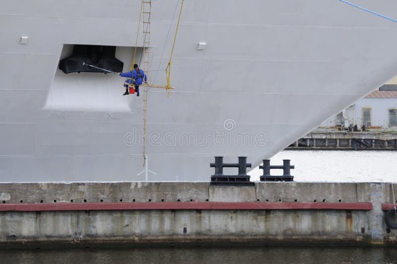 Painter with a Paint Roller Coating Hull of a Ship Editorial Stock ...