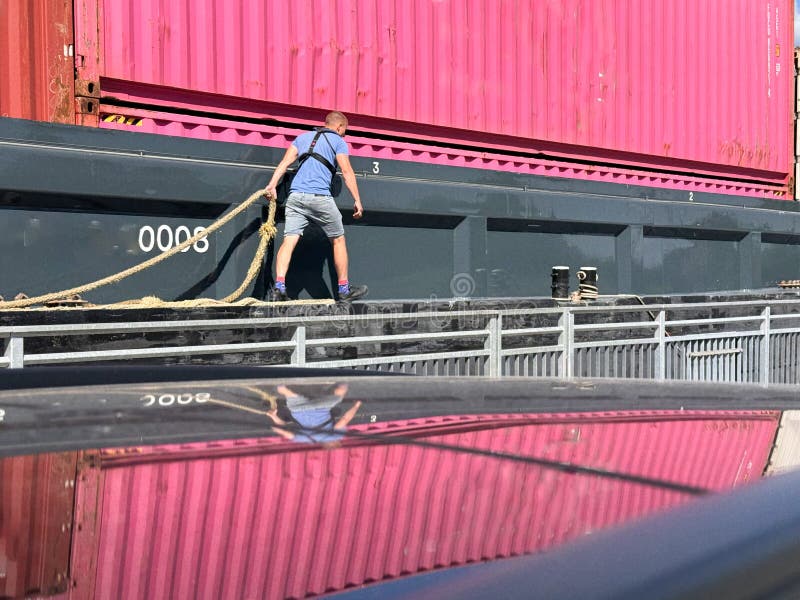 Sailor Pulling Ropes To Tie a Boat To the Dock Stock Photo - Image of ...