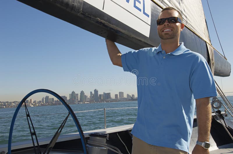 Sailor Smiling on Yacht in Ocean Stock Image - Image of yacht, sunny ...