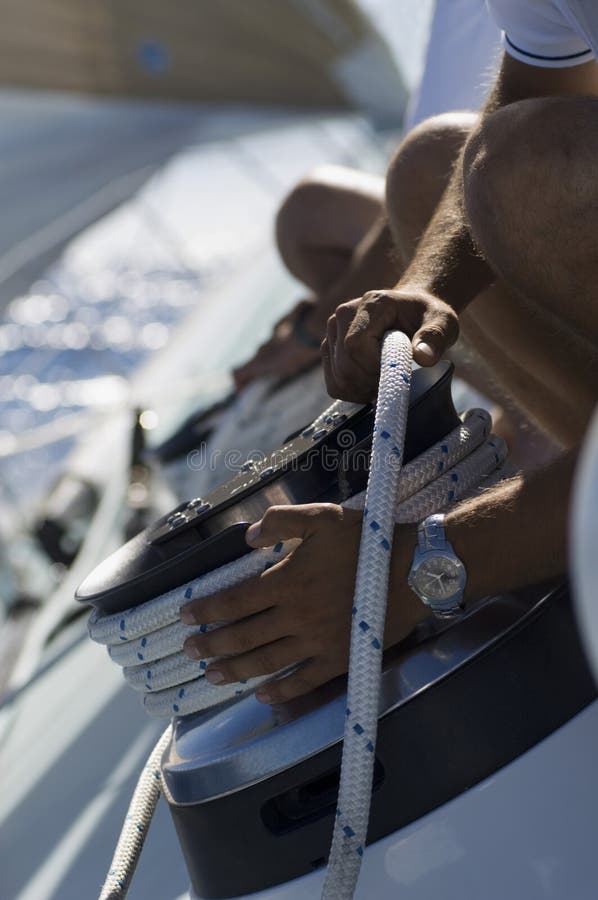 Sailor Tying Rope Onto Windlass Close-up of Hands Stock Photo - Image ...