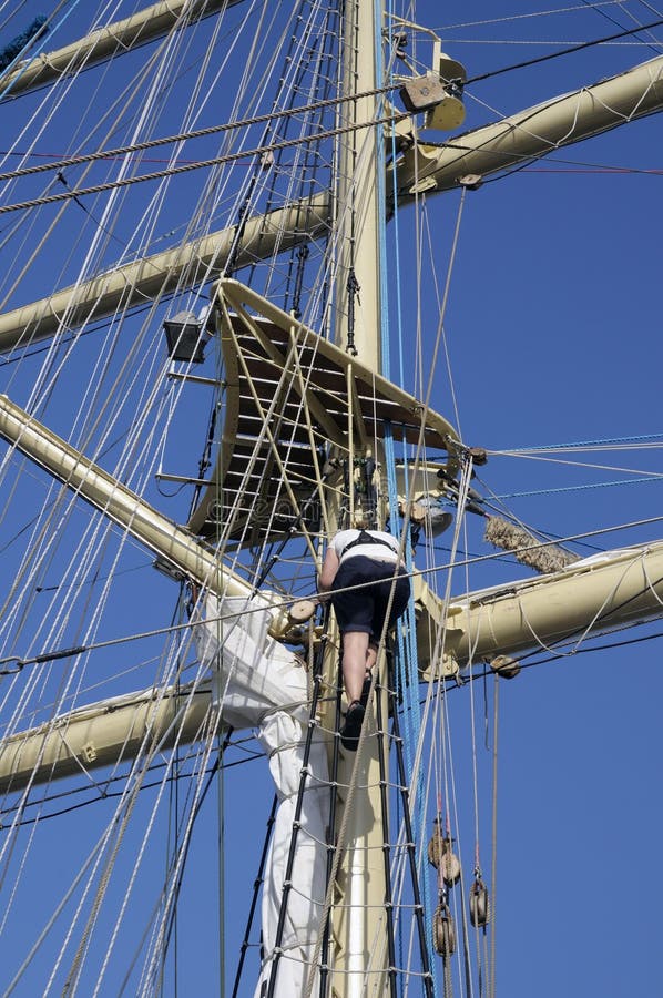 Sailor Working in the Rigging of a Sailboat Stock Photo - Image of ...