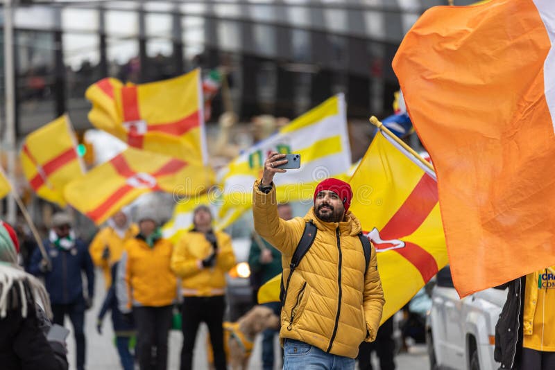 Saint Patrick S Day Parade with a Man Taking a Selfie in Front of a ...