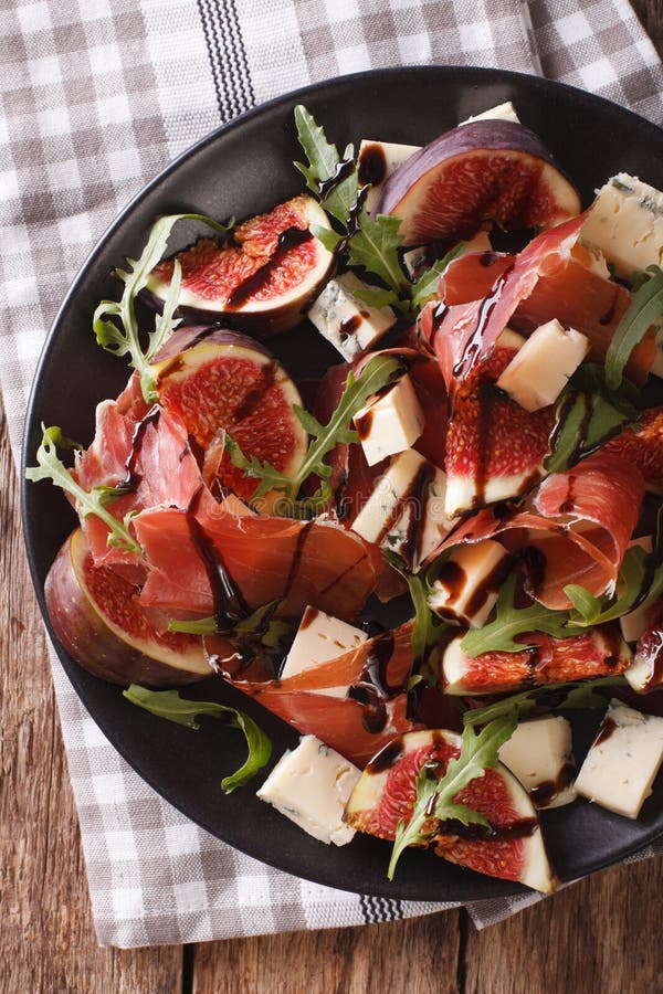 Salad with Figs and Parma Ham Dressed with Balsamic Sauce. Verti Stock ...