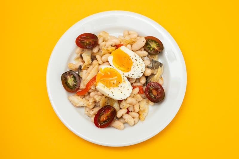 Salad with Fried Cod Fish and White Beans on the Plate. Stock Photo ...