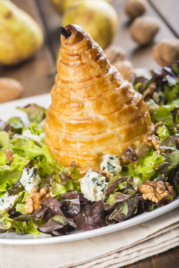 Salad of Nut Lettuce with a Pear in Puff Pastry Stock Image - Image of ...