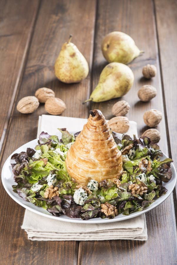 Salad of Nut Lettuce with a Pear in Puff Pastry Stock Image - Image of ...