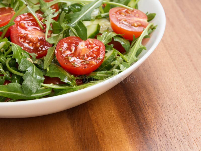 Salad from Ruccola, Cherry Tomatoes and Cucumber Stock Photo - Image of ...