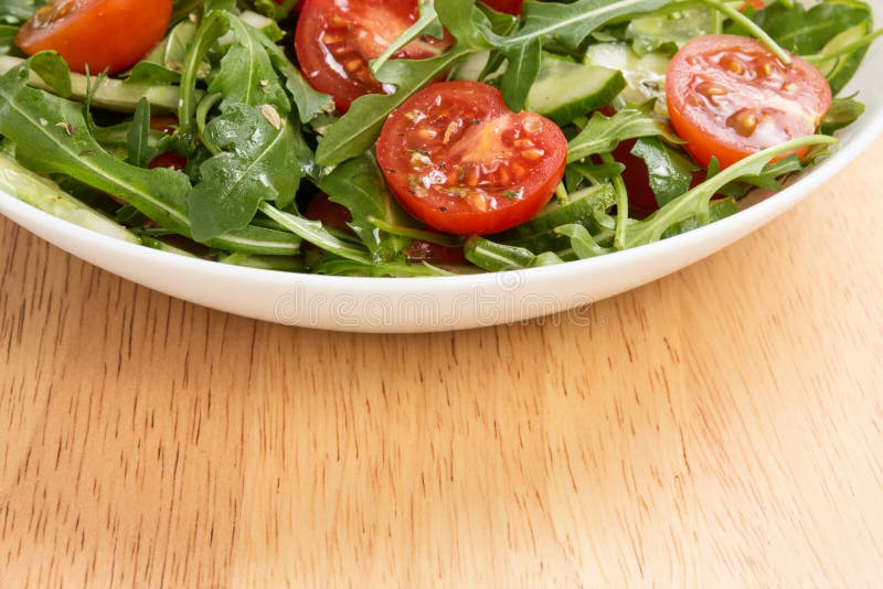 Salad from Ruccola, Cherry Tomatoes and Cucumber Stock Photo - Image of ...