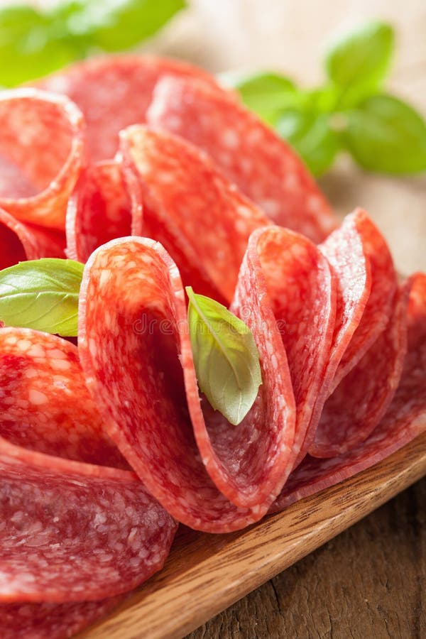 Salami Slices in Wooden Plate Stock Image - Image of gourmet, rustic ...