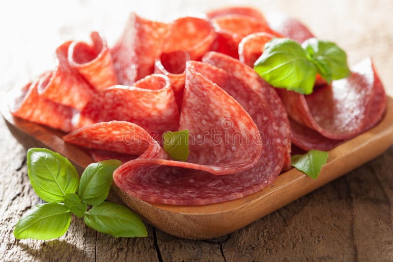 Salami Slices in Wooden Plate Stock Photo - Image of pepper, appetizer ...