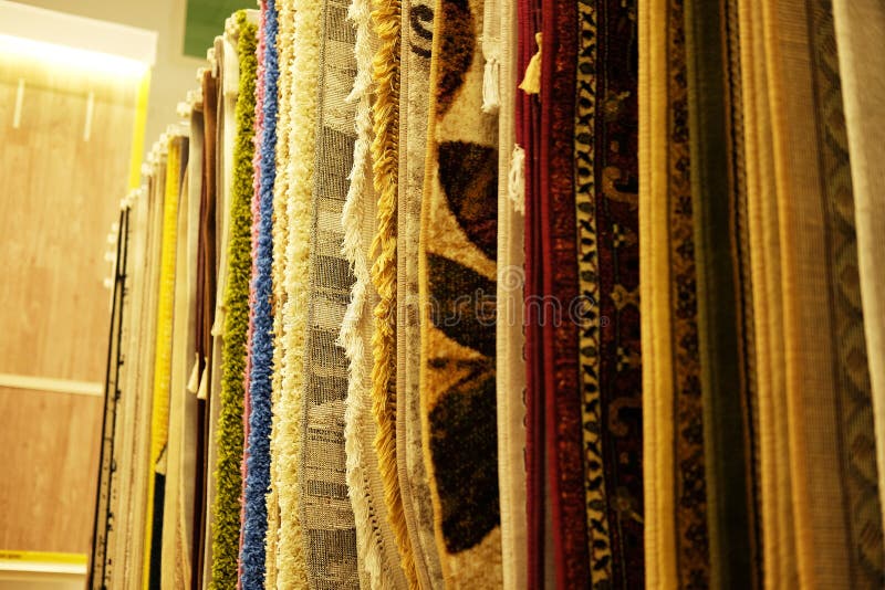 Sale. Assortment of Different Carpets in Store. Close -up Picture Stock ...