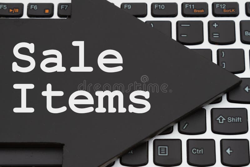 Sale Items Message on Chalkboard Arrow Card on a Keyboard Stock Photo ...