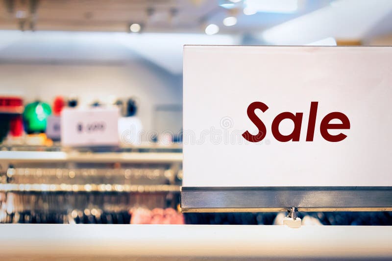 Sale Sign in a Modern Clothing Store Stock Image - Image of market ...