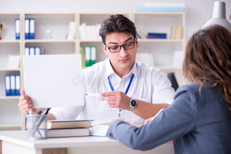 The Sales Assistant Discussing Transaction with Customer Stock Photo ...