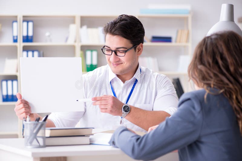 The Sales Assistant Discussing Transaction with Customer Stock Photo ...