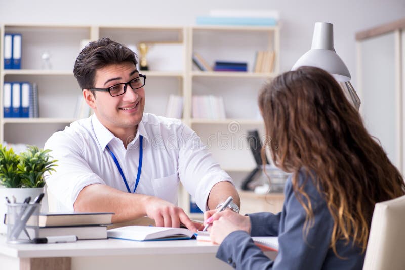 The Sales Assistant Discussing Transaction with Customer Stock Image ...