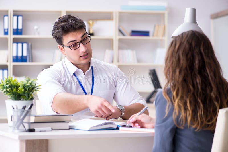 The Sales Assistant Discussing Transaction with Customer Stock Image ...