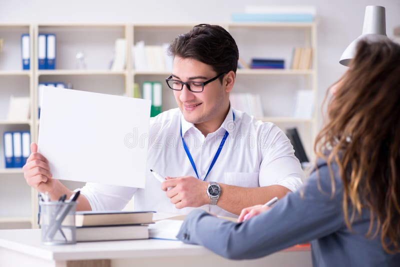 The Sales Assistant Discussing Transaction with Customer Stock Photo ...