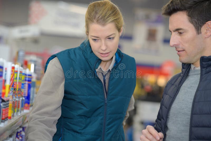 Sales assistant at work stock photo. Image of store - 261512874