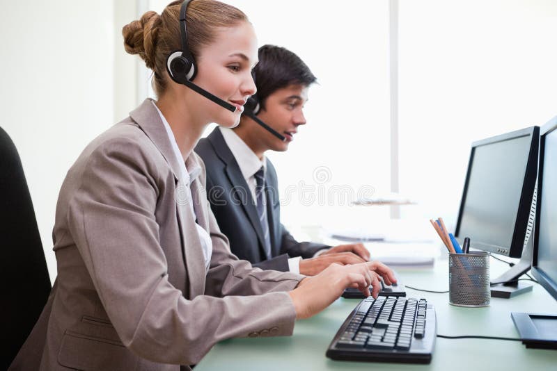 Sales Assistants Working with Computers Stock Photo - Image of business ...