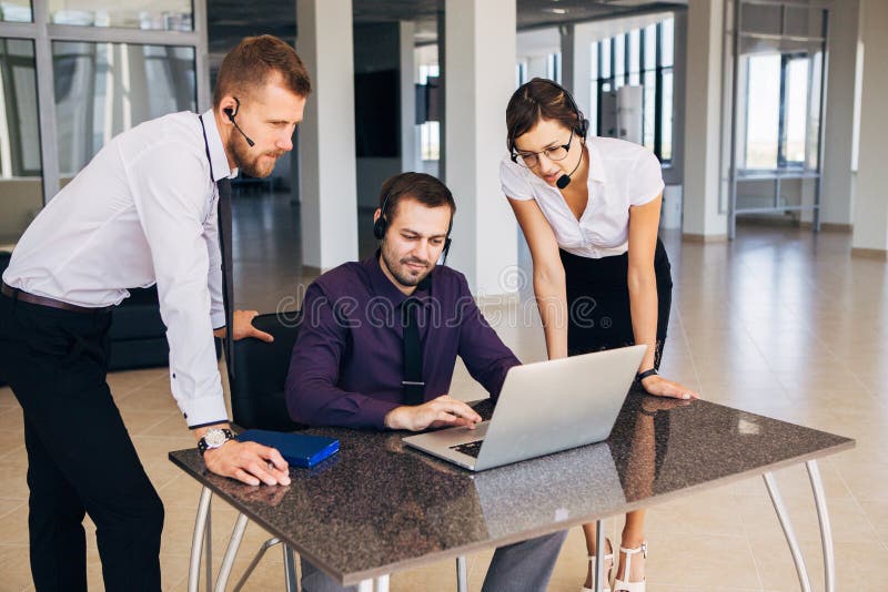 Sales Assistants Working with Computers in an Office Stock Image ...