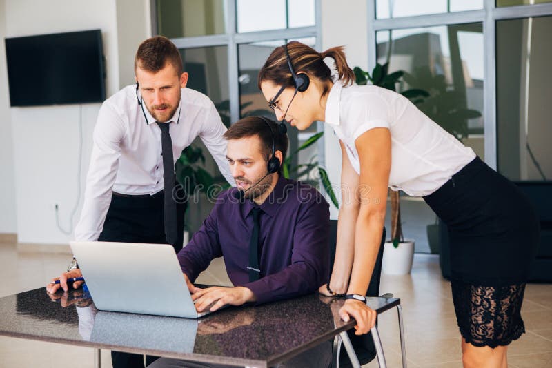 Sales Assistants Working with Computers in an Office Stock Photo ...