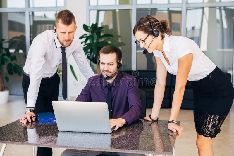 Sales Assistants Working with Computers in an Office Stock Photo ...