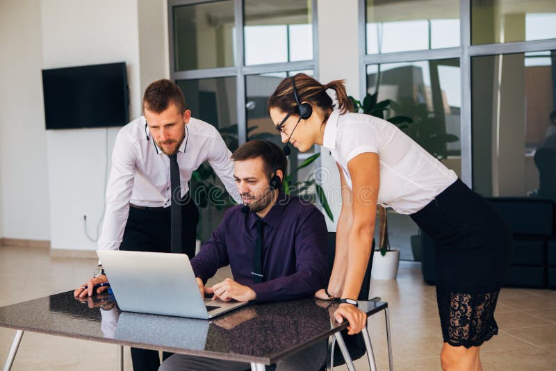 Sales Assistants Working with Computers in an Office Stock Photo ...