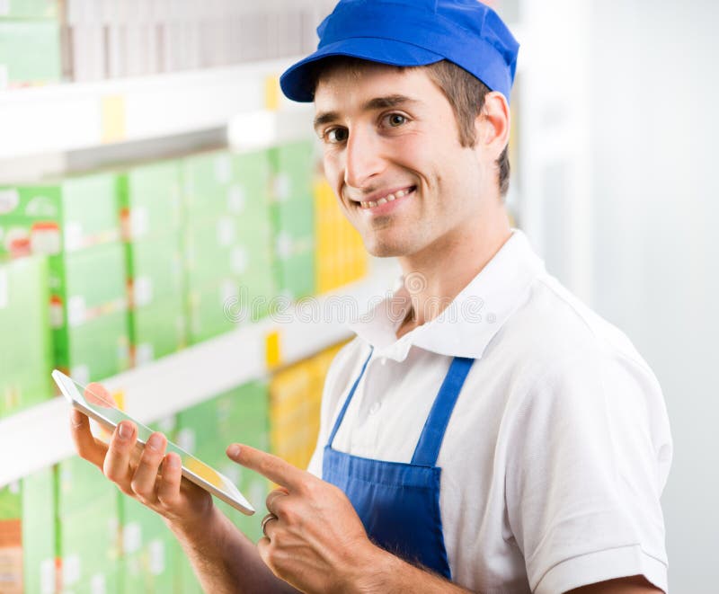 Sales clerk with tablet stock image. Image of clean, mall - 47985809