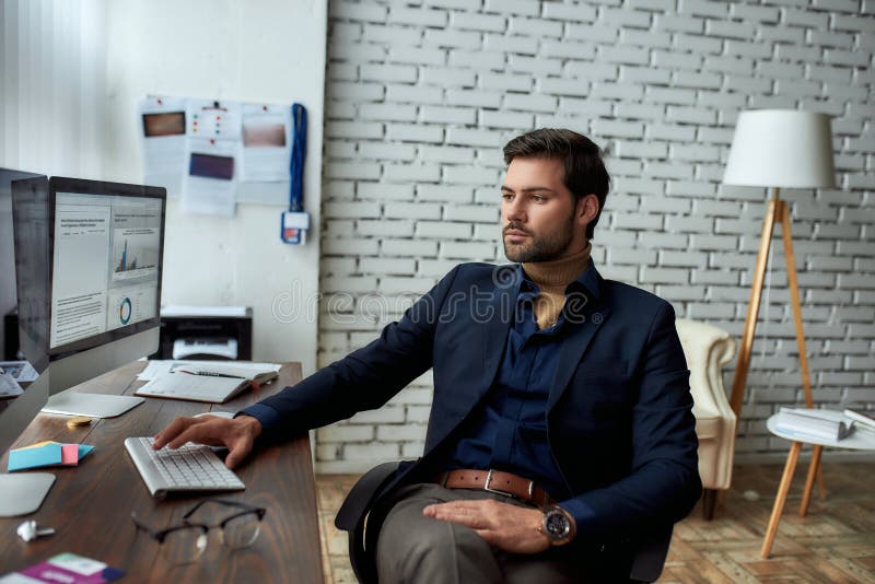 Sales Manager Working in the Modern Office. Side View of a Young ...