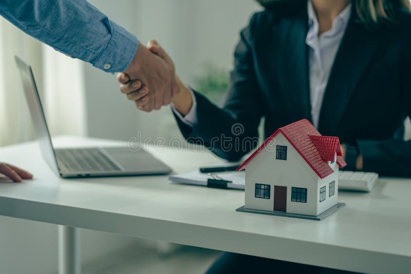 Sales Representatives Shake Hands with Customers and Offer Home ...