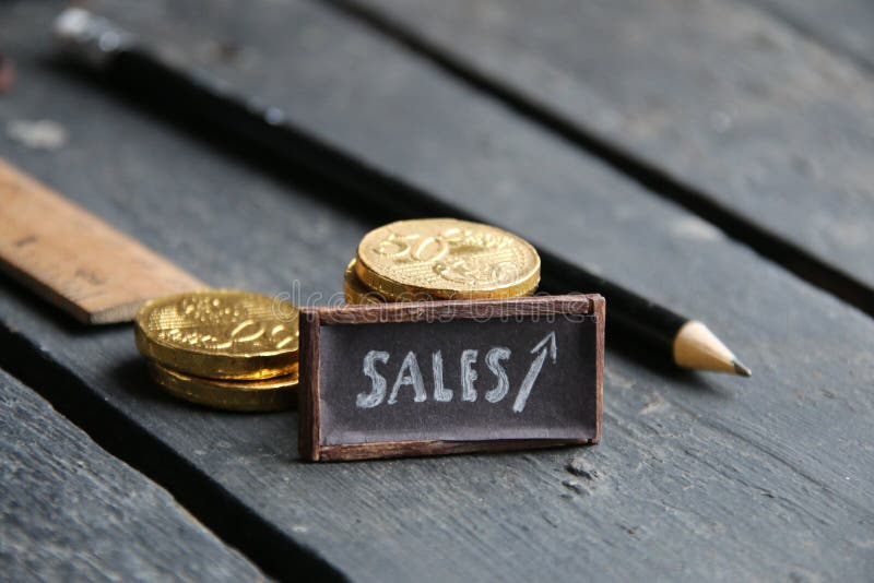Sales Tag and Piles of Gold Coins on a Vintage Table Stock Photo ...