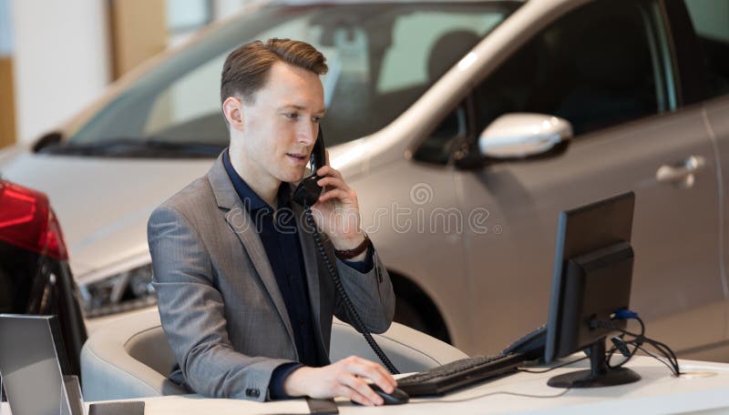 Sales Talking on Phone while Using Computer Stock Photo - Image of male ...