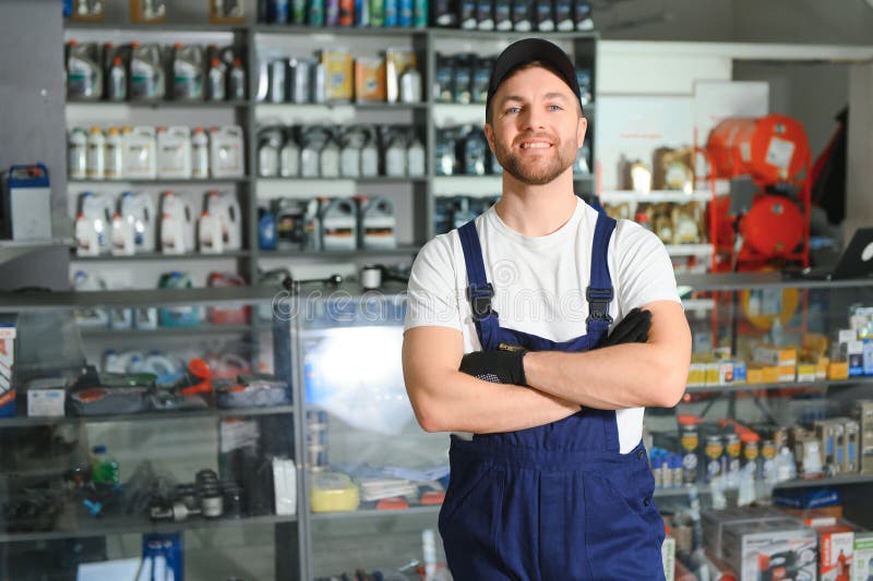 A Salesman in an Auto Parts Store. Retail Trade of Auto Parts Stock ...