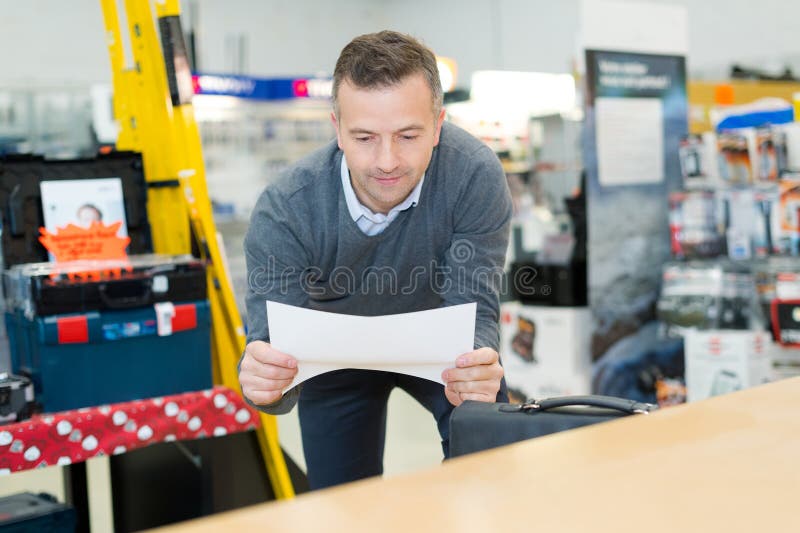 Salesman in book store stock image. Image of handmade - 300772031