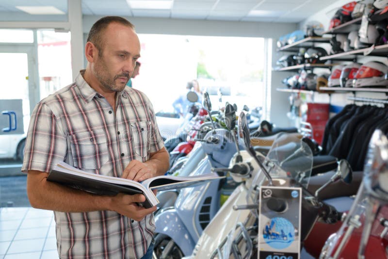 Salesman with Client in Bike Shop Stock Image - Image of cool, rider ...