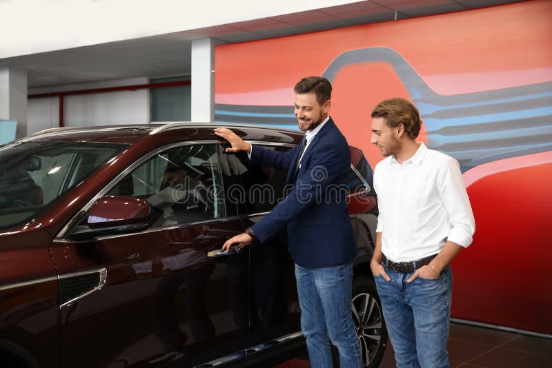 Salesman with Customer in Modern Car Stock Photo - Image of manager ...