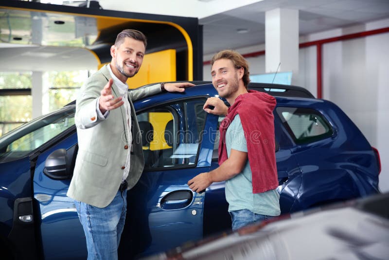 Salesman with customer stock photo. Image of sale, driver - 132585196